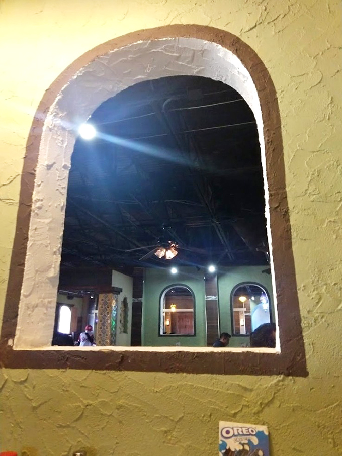 Charming archways frame views into neighboring dining areas, creating the feeling you've stepped into a hacienda rather than a Mississippi restaurant.