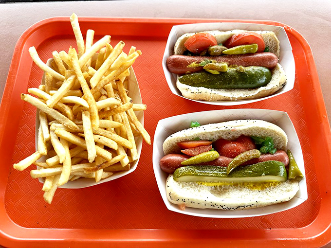A tray of Woofie's dogs isn't just lunch&mdash;it's a choose-your-own-adventure story where every ending is delicious. The fries are non-negotiable companions.