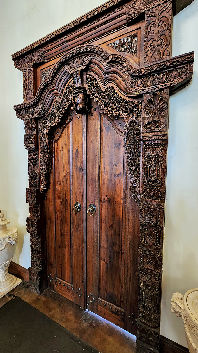 This intricately carved wooden door belongs in a museum&mdash;or exactly where it is, adding authentic medieval charm to the castle interior.