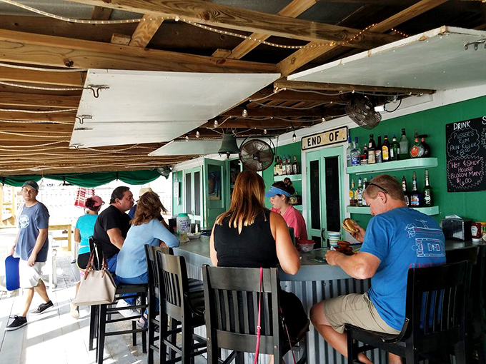 Where "END OF" sign should really finish with "your search for authentic seafood" &ndash; no pretension, just perfect libations.