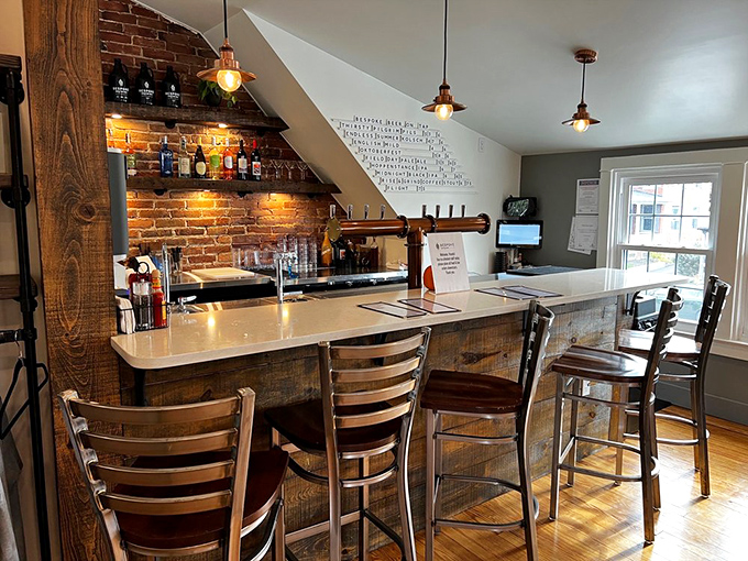 The bar area combines brick, wood, and pendant lighting in a way that makes you want to linger. Coffee counter or rustic art installation? Both.