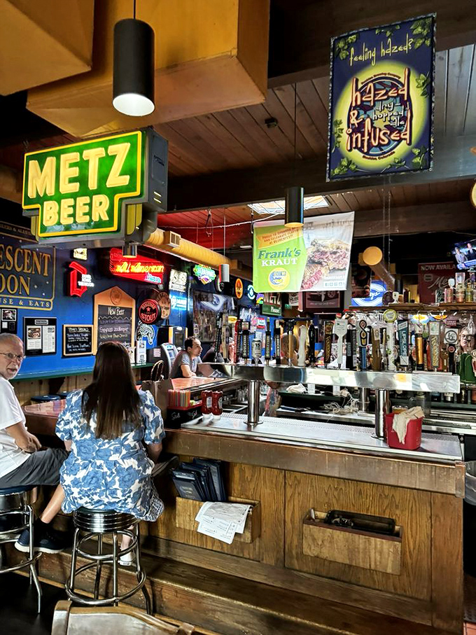 The bar area&mdash;where beer signs glow like beacons of hope and tap handles stand at attention, ready for duty.