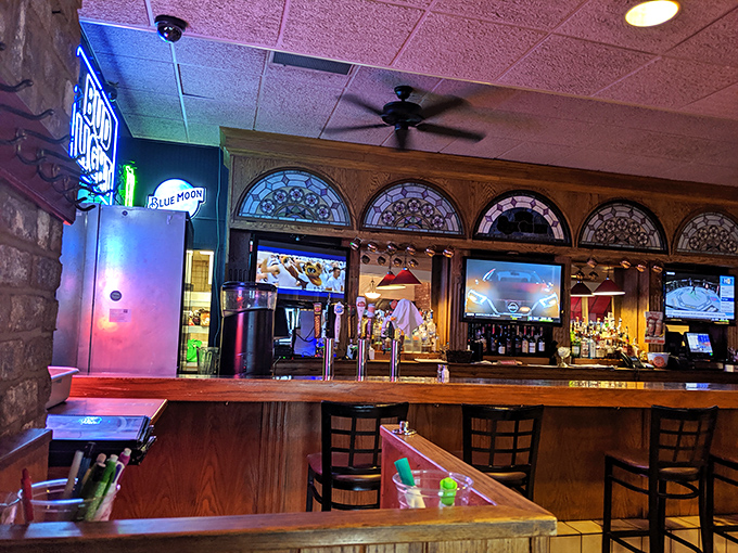 Stained glass meets sports bar in this cozy corner where Blue Moon signs illuminate conversations about last night's game and tomorrow's dinner plans.