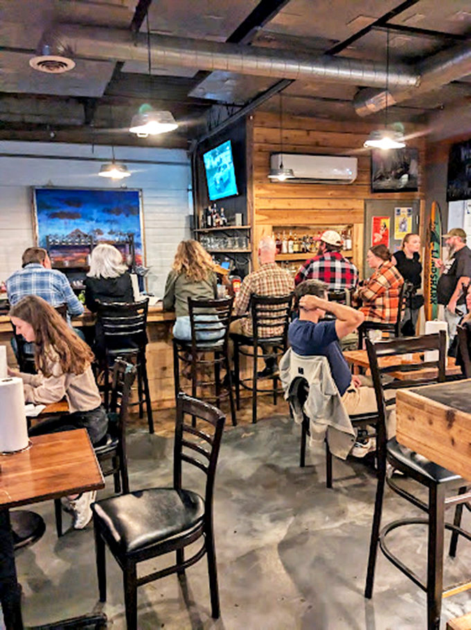 The bustling bar area hums with conversation and clinking glasses. Here, strangers become friends over shared plates and stories, united by their appreciation for exceptional seafood.