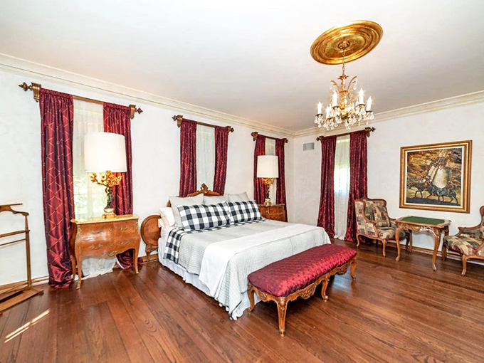 Sleep like nobility in chambers that balance historical elegance with modern comfort. Those red drapes could tell tales of countless dreams.