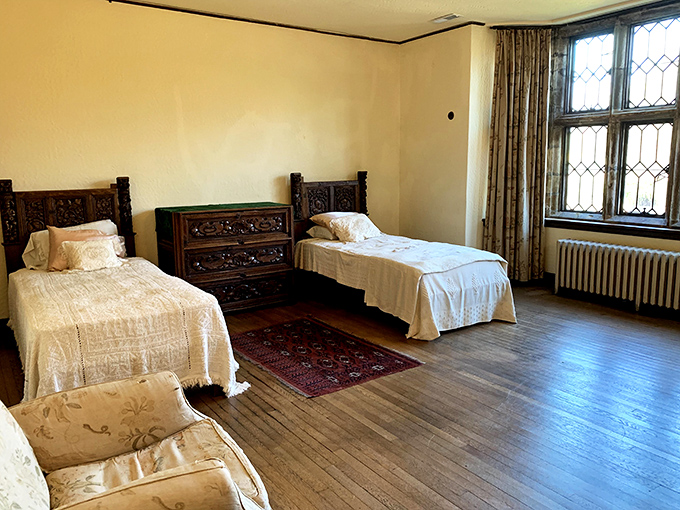 Guest bedrooms fit for visiting diplomats, with carved headboards that have likely witnessed more interesting conversations than most hotel rooms.
