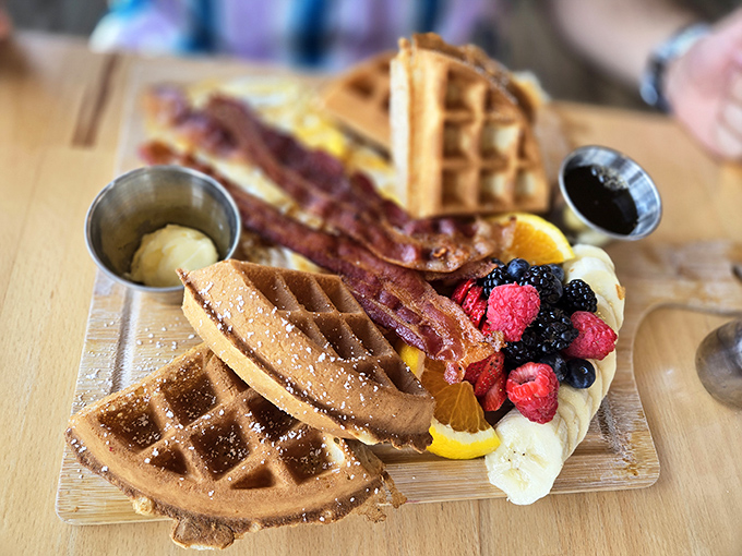 Waffles, bacon, and berries: the holy trinity of breakfast indulgence. Not all heroes wear capes&mdash;some wear maple syrup and powdered sugar.