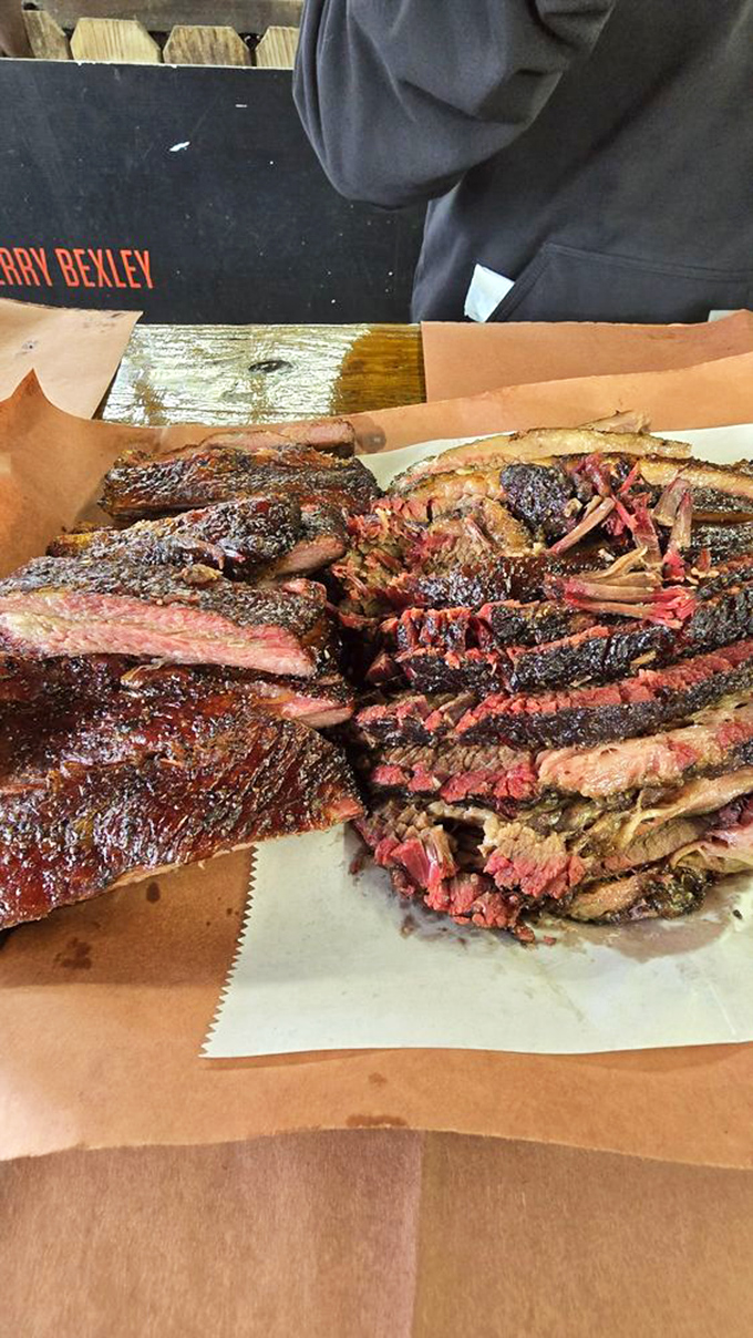A Texas-sized BBQ platter featuring brisket with that telltale smoke ring—the barbecue equivalent of nature's perfect sunset.