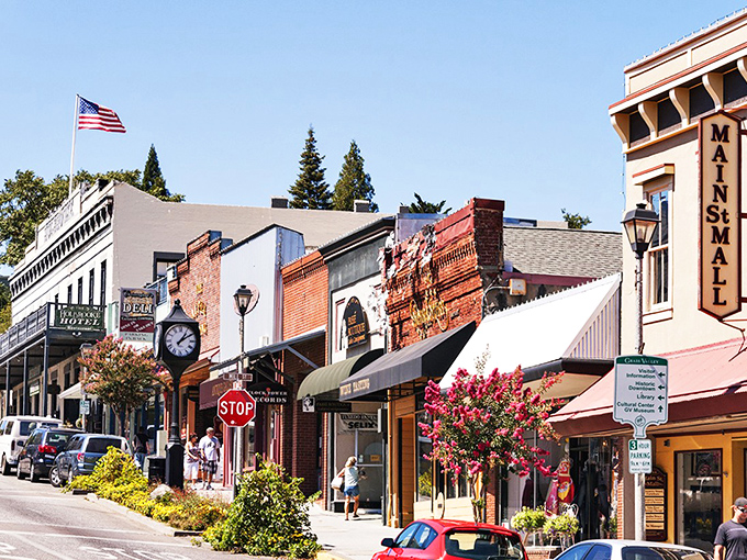 Main Street's clock and American flag frame a scene straight from a Norman Rockwell painting, if Rockwell had included artisanal coffee shops.