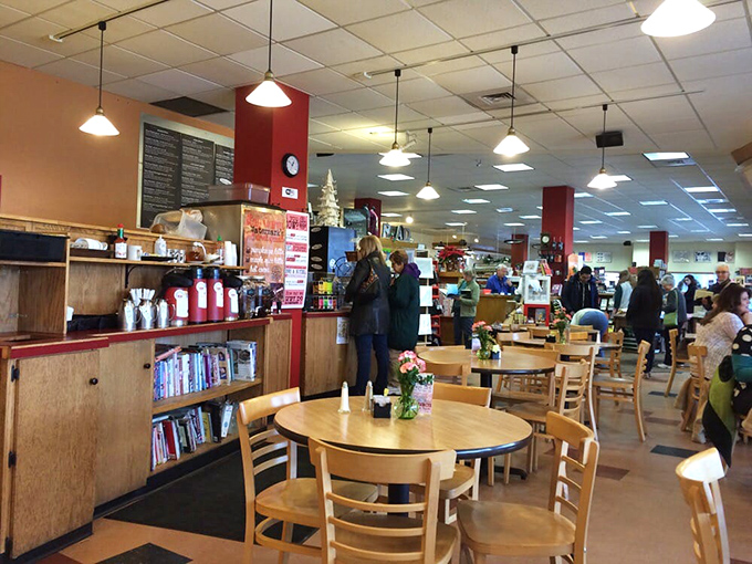 The cafe's wooden tables and pendant lights create the atmosphere where "just five more minutes" turns into finishing the entire chapter.