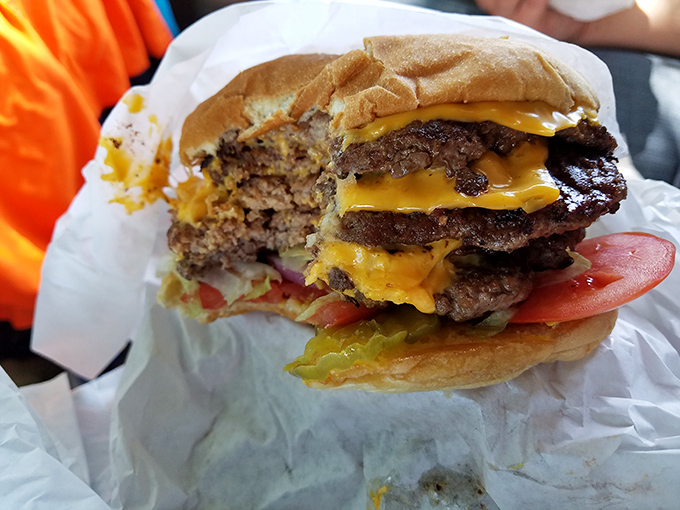 This cross-section reveals the burger's magnificent strata&mdash;each layer of beef, cheese, and fresh veggies in perfect harmony.