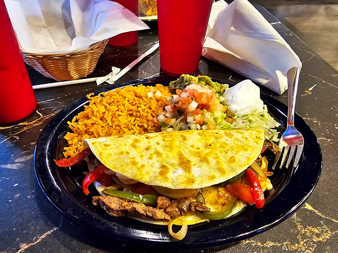 Green sauce enchiladas with a blanket of cheese and fresh onions. If comfort food had a beauty pageant, this would take the crown.