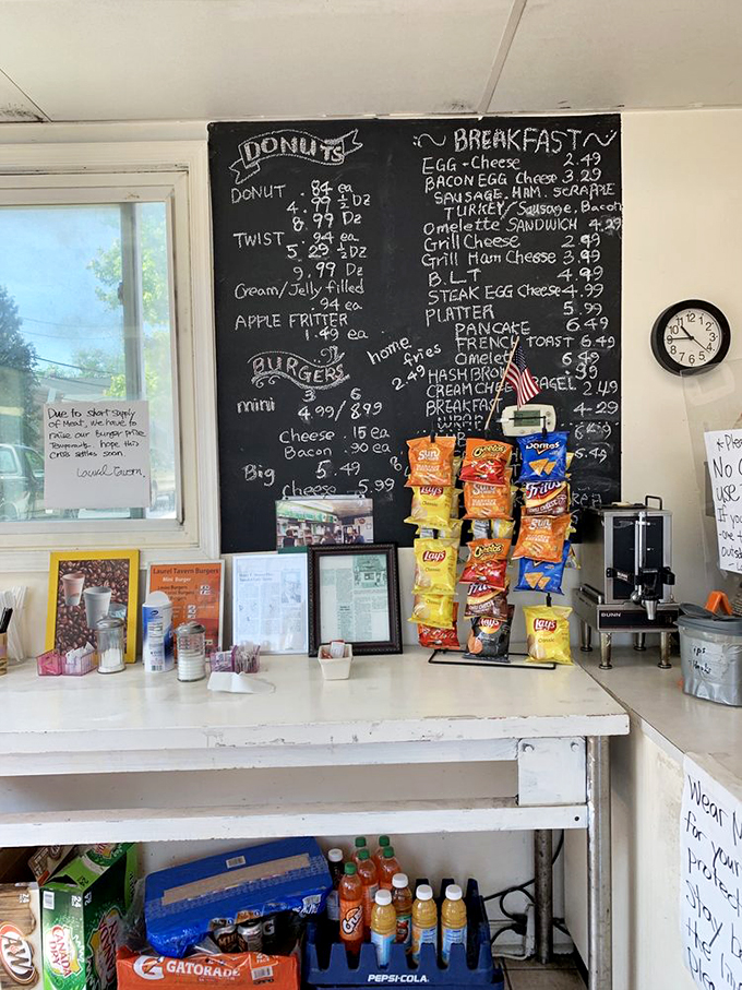 The chalkboard menu&mdash;where prices are reasonable and options plentiful. Notice the American flag, because what's more patriotic than donuts?