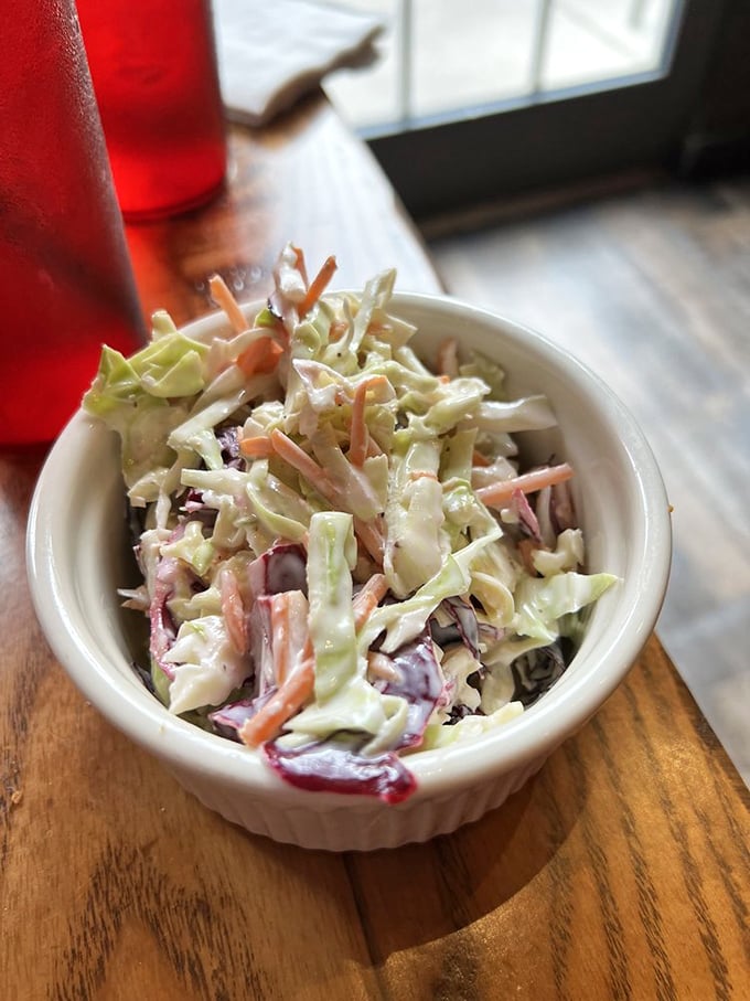 This isn't just coleslaw&mdash;it's a palate cleanser between bites of fried glory, a crisp, creamy counterpoint to all that Southern-fried decadence.