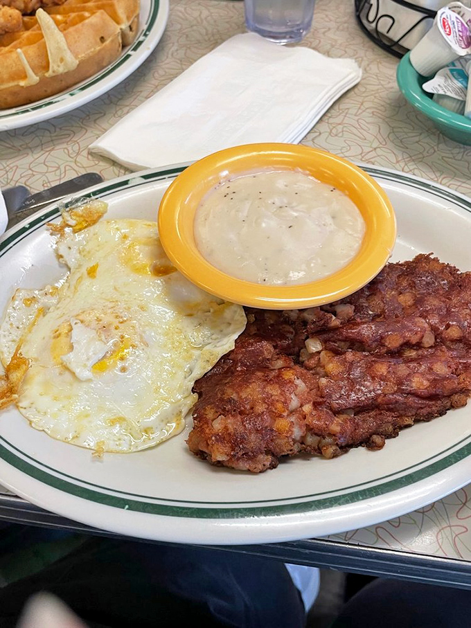 Country ham and eggs with a side of gravy&mdash;the kind of plate that makes you want to find the nearest rocking chair and contemplate life's simple pleasures.