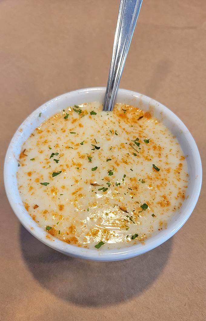 Cream of crab soup so rich and velvety it should come with its own warning label: "May cause spontaneous sighs of contentment and requests for second bowls."