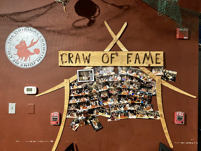The "Craw of Fame" wall celebrates seafood warriors who came, saw, and conquered. Like a maritime hall of fame where the only qualification is a hearty appetite.