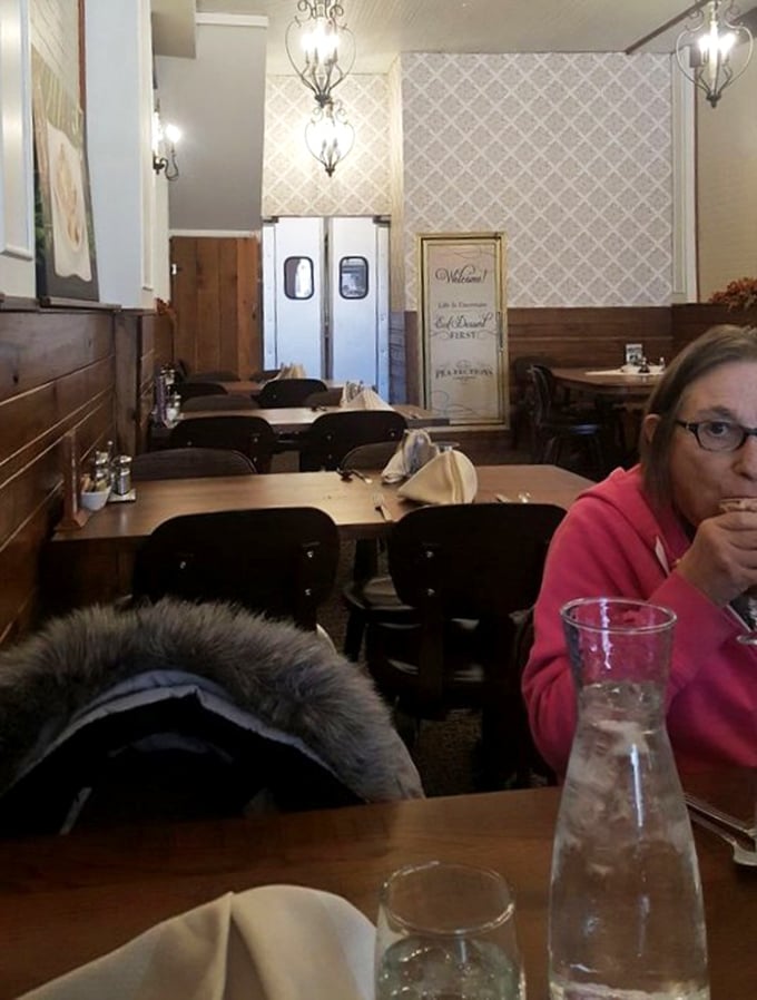 Even the dining room says "welcome home" with its cozy booths and vintage charm. The kitchen doors swing with promises of sweetness to come.