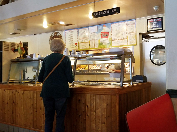 The ordering counter&mdash;where chicken dreams come true. That "Place Orders Here" sign might as well say "Happiness Starts Here."