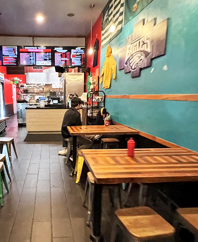 The turquoise wall featuring an Eagles logo tells you everything you need to know: this is Philly territory in 49ers country.