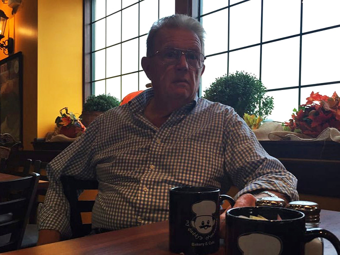 A regular patron enjoys his coffee in the warm interior&mdash;living proof that the caf&eacute; has mastered the art of creating devoted customers.