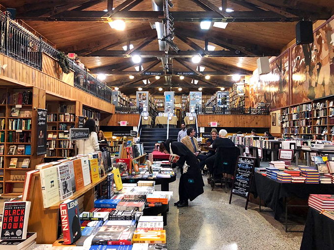Serious readers engaged in the sacred act of browsing. Notice how everyone maintains the unspoken bookstore code of reverent quiet.