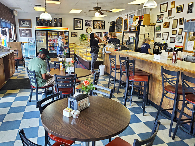 Where strangers become friends over shared sugar rushes. The communal tables have witnessed countless donut epiphanies.