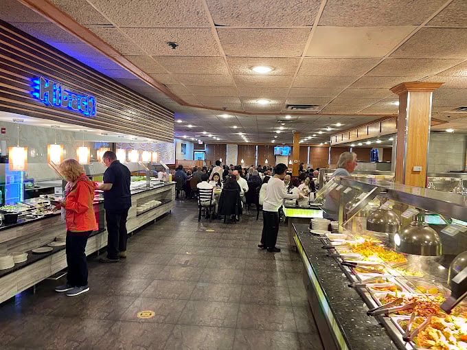 The dining room hums with the satisfied murmurs of patrons engaged in the serious business of getting their money's worth.