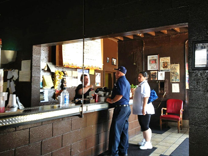 At the counter, where barbecue dreams come true. The anticipation in line at Leo's is like waiting for concert tickets, but the payoff is much tastier.