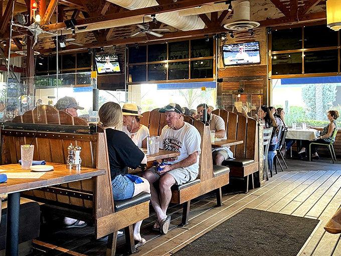 Diners enjoying the relaxed atmosphere where conversations flow as freely as the drinks. No dress code, just good food and better company.