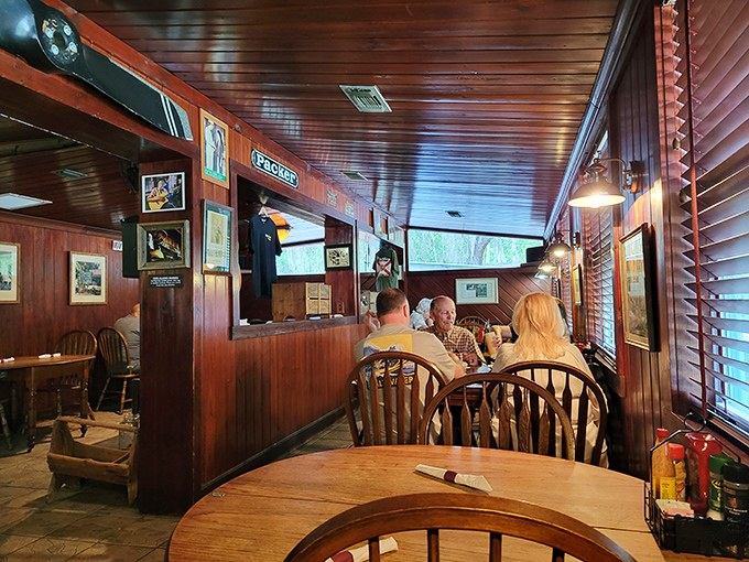 Where wood-paneled walls hold decades of dinner conversations. Every chair has supported a local, a tourist, or maybe even a character from Rawlings' novels.