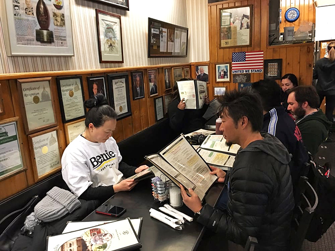 Every booth tells a story. In this diner, strangers become neighbors over shared ketchup bottles and political opinions.
