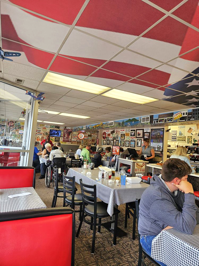 Where strangers become neighbors over eggs and coffee. The American flag ceiling tiles remind you this is patriotic eating.