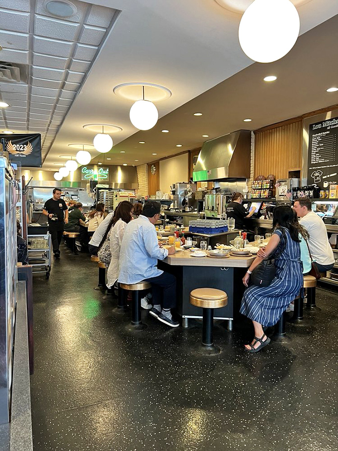 The counter seating isn't just efficient—it's theater in the round, where regulars and tourists alike get front-row seats to the breakfast show.