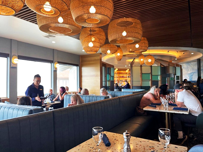 The best entertainment isn't on your phone&mdash;it's watching happy diners navigate seafood feasts beneath those basket-weave lamps that whisper "coastal elegance."