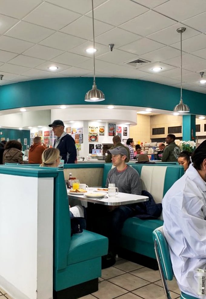 Where strangers become neighbors over eggs and coffee. The bustling interior captures that magical diner energy where everyone belongs.