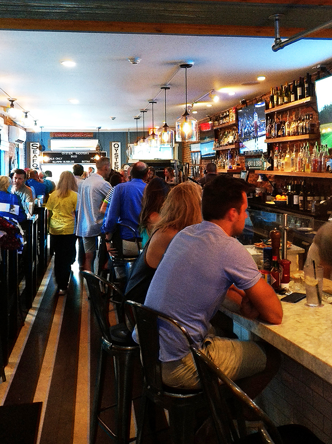 The packed bar proves the universal truth: people will always gather where the oysters are fresh and the drinks flow freely.
