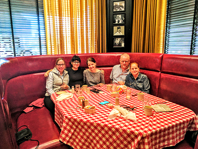 Happy faces and full plates! This booth is serving up more than just steak &ndash; it's dishing out memories that'll last longer than your food coma.