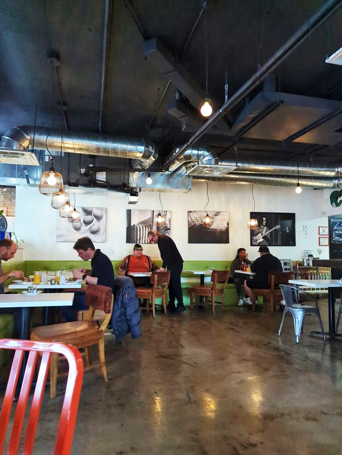 A restaurant where people actually talk to each other instead of their phones. That exposed ductwork overhead? It's channeling good vibes, not just air.