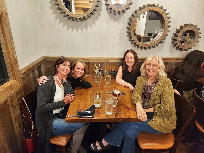 A table of friends enjoying the universal truth that good food tastes even better when shared with people you actually like.