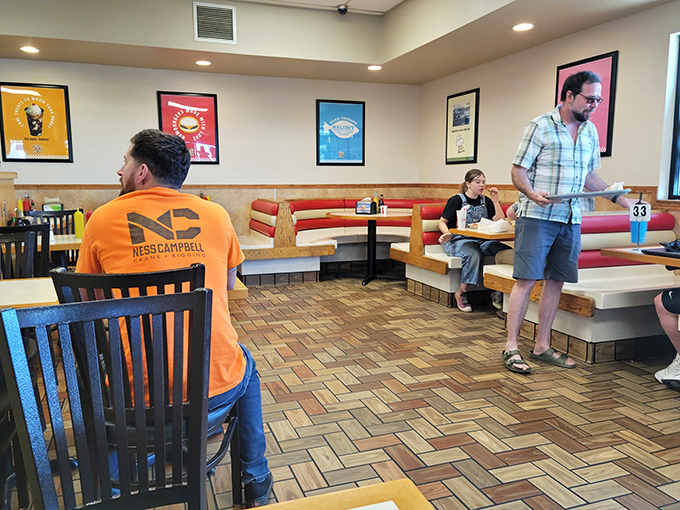 Colorful food-themed artwork watches over diners like guardian angels of appetite, promising good things to come. 