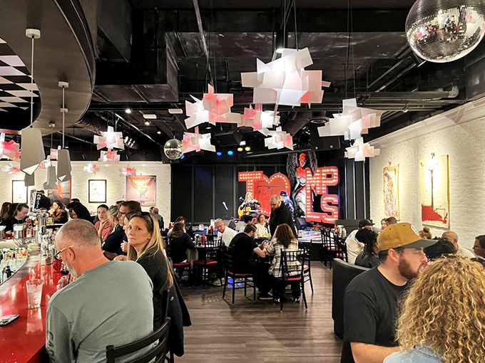 The weekend brunch scene: A buzzing hive of conversation and clinking glasses under sculptural light fixtures &ndash; worth every minute of the legendary wait.