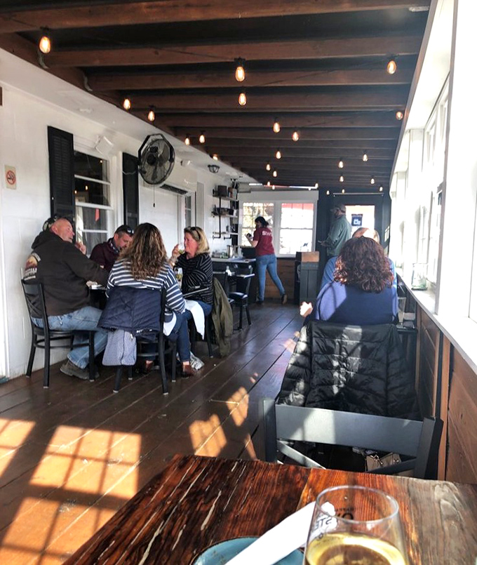 Where strangers become friends over shared seafood platters. The real Virginia social network happens at these tables, no Wi-Fi password required.