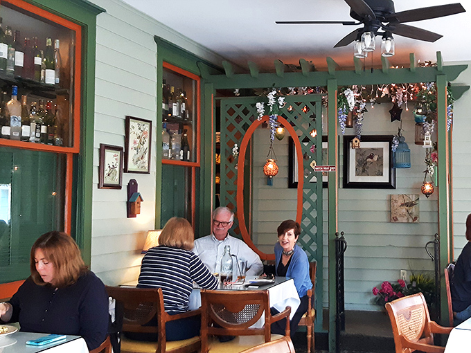 Even the indoor garden room feels like dining in a well-curated secret garden, where lattice and hanging plants create conversation-friendly nooks.
