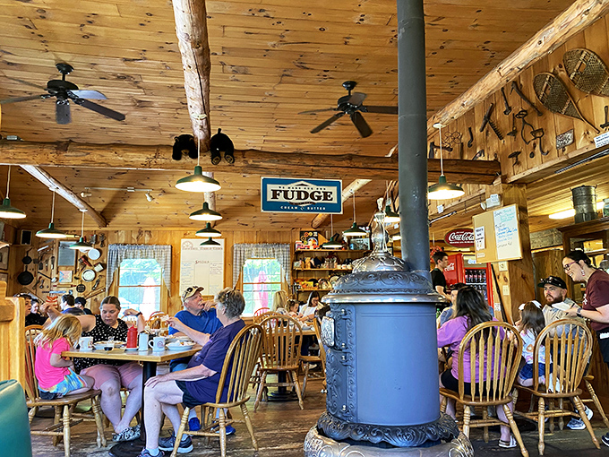 The antique wood stove anchors the dining room like a cast iron sentinel. Families gather around tables, creating memories between bites of pancake.
