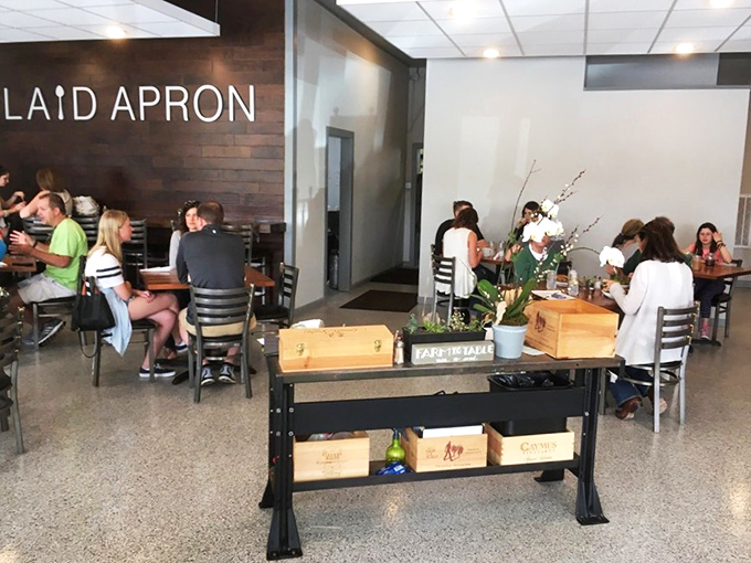 A bustling dining room where strangers become temporary neighbors, united by the universal language of "mmm" and "you have to try this."