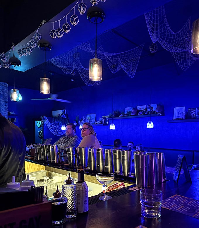 Behind the bar, mixologists work with the focused precision of scientists who discovered that rum is more fun than chemistry.