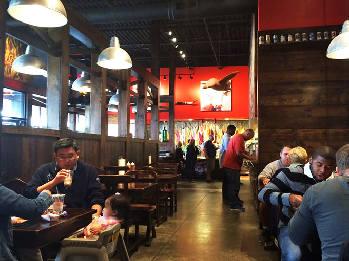 A dining room filled with the universal language of BBQ appreciation. Notice no one's looking at their phones &ndash; that's the power of proper smoked meat.
