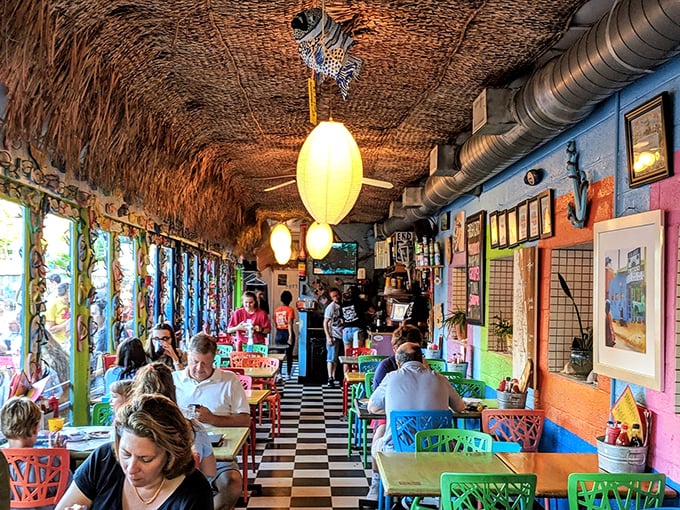 Under a ceiling of woven thatch, diners escape the everyday in a riot of color. The beach shack vibe is strong enough to make you check for sand.