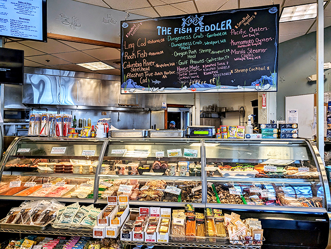 The seafood case gleams like a treasure chest, with the chalkboard menu above promising delicious adventures for hungry travelers.